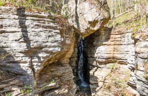 Suspended in Nature: The Magic of Balanced Rock Falls - Somewhere In ...